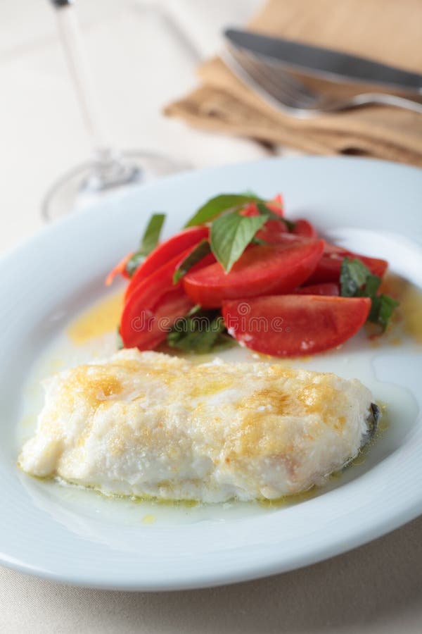Baked Cod Fillet with Salad Stock Image - Image of tomato, vertical ...