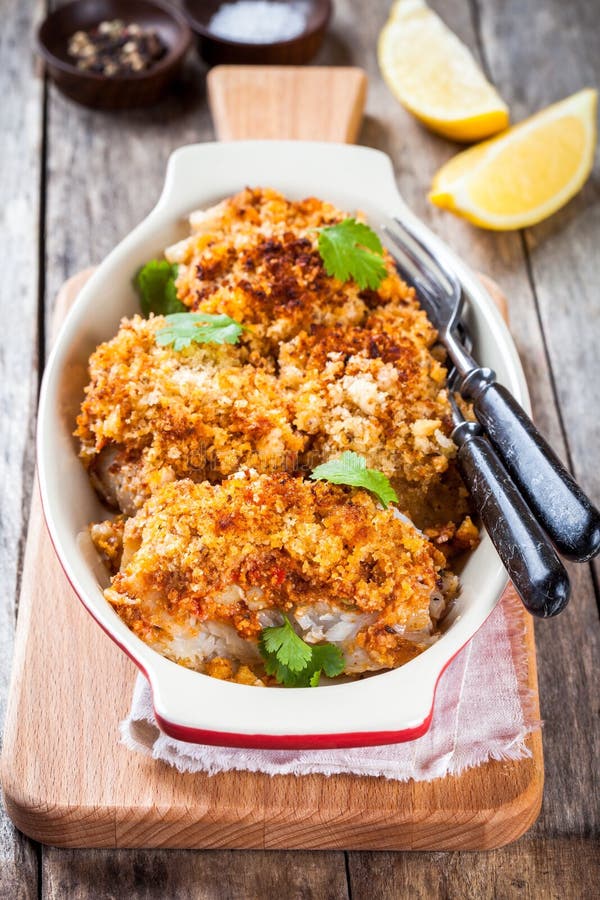 Baked Cod Fish in Breadcrumbs in Gratin Dish Stock Photo - Image of ...