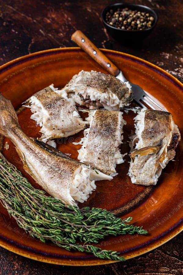 Baked Cod White Fish in a Plate. Dark Wooden Background Stock Image ...