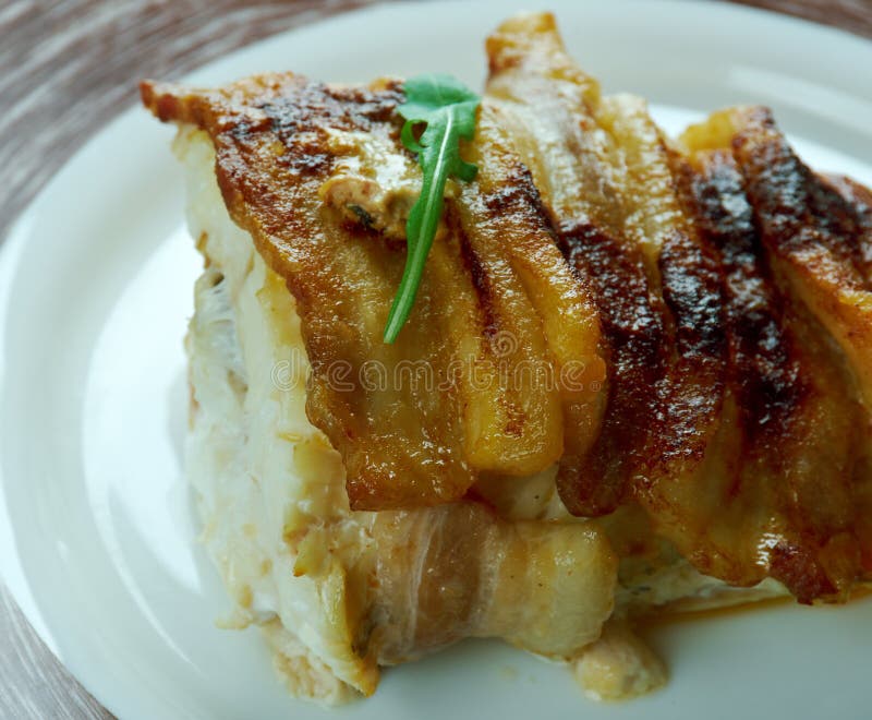 Baked cod wrapped in bacon stock photo. Image of close - 71915124