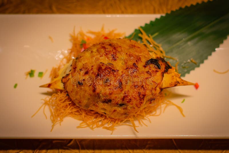 Baked Crab Shell Stuffed with Crab Meat and Black Truffle Paste Stock ...