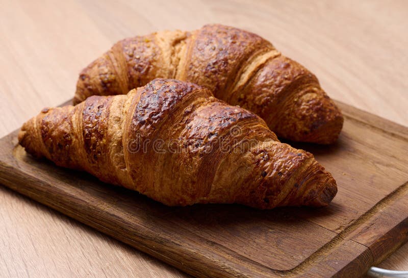 Baked Crispy Croissant on a Wooden Board, Breakfast Stock Photo - Image ...