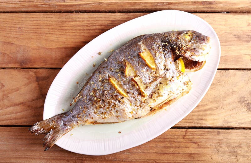 Baked Dorada Fish with Lemon and Herbs Stock Image - Image of dinner ...
