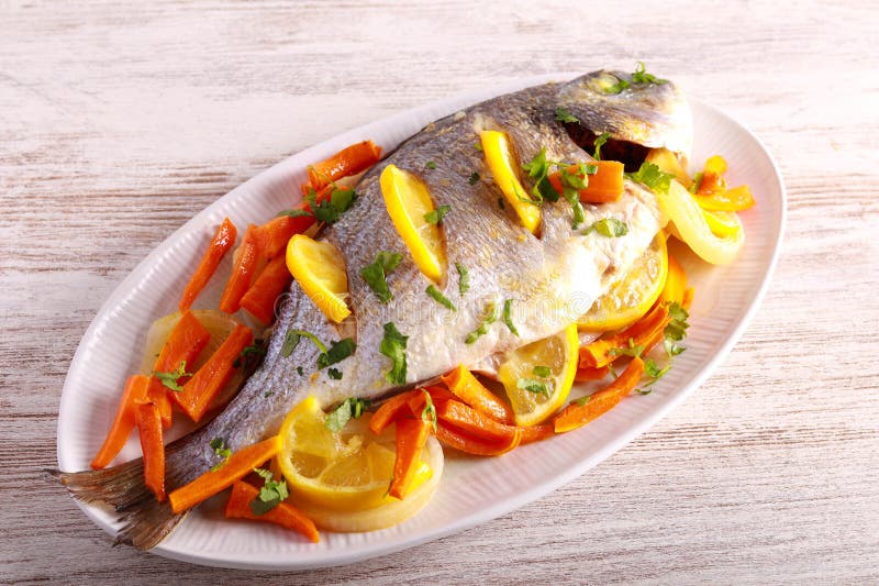Baked Dorada Sea Bream Fish with Lemon Stock Image - Image of carrot ...