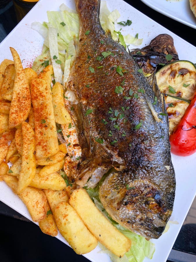 Baked Dorada with Vegetables and Fries on a Plate Stock Image - Image ...