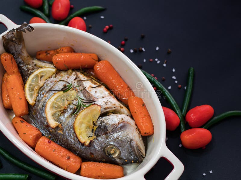 Baked Dorado Fish with Spices Lemon and Vegetables, Cooking on Baking ...