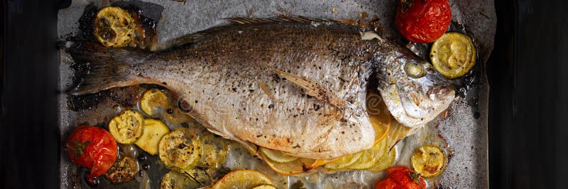 Baked Dorado Fish with Vegetables on Baking Sheet Stock Image - Image ...
