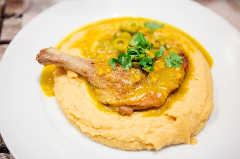 Baked Duck Leg with Chickpea Mash Stock Photo - Image of spoon ...