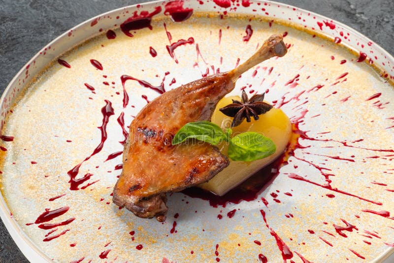 Baked Duck Leg with Pear and Sauce on a Plate Stock Image - Image of ...
