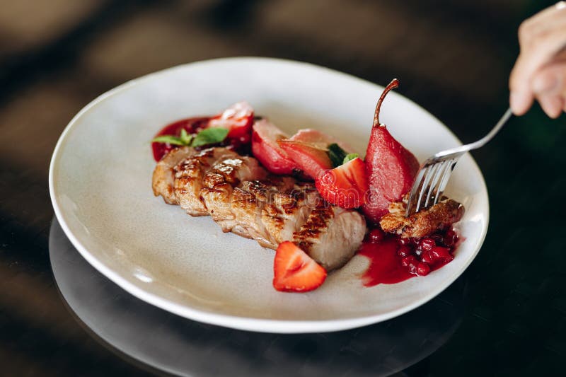 Baked Duck with Pear and Strawberries in Cranberry Sauce Stock Photo ...