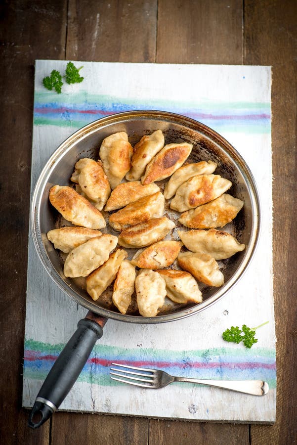 Baked Dumplings on a Cast-iron Frying Pan Stock Image - Image of ...