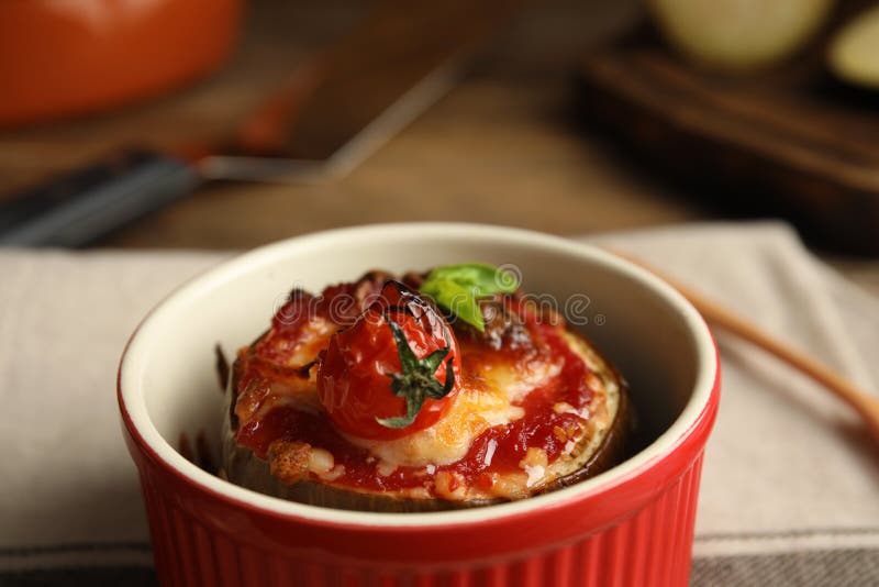 Baked Eggplant with Tomatoes, Cheese and Basil in Ramekin on Table ...