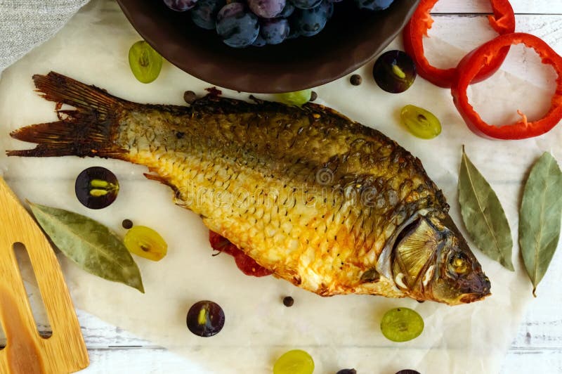 Baked Fish Carp, Stuffed Bell Peppers and Grapes Stock Image - Image of ...