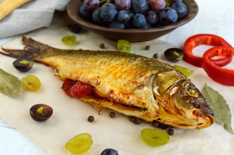 Baked Fish Carp, Stuffed Bell Peppers and Grapes Stock Image - Image of ...