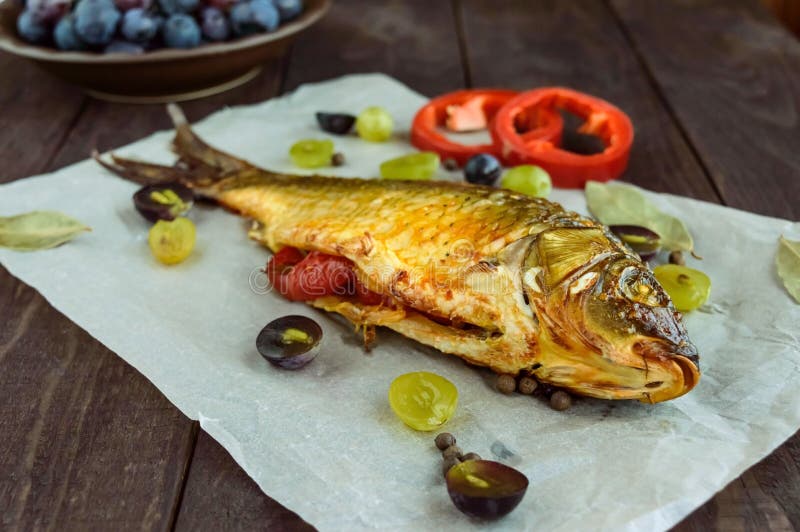 Baked Fish Carp, Stuffed Bell Peppers and Grapes Stock Photo - Image of ...