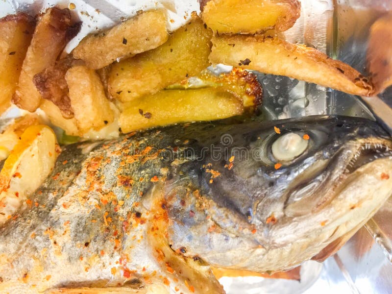 Baked Fish and Fried Potatoes Stock Photo - Image of yummy, fish: 82214590