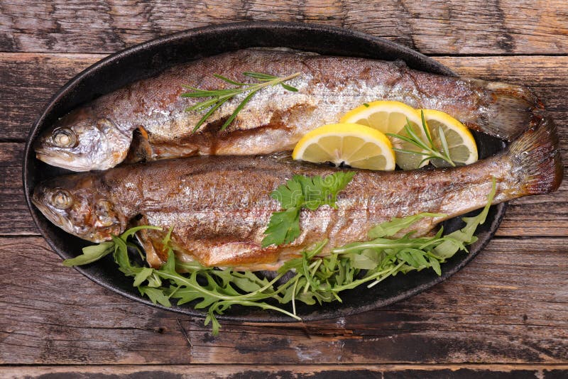 Baked fish and lemon stock photo. Image of wood, healthy - 225344792