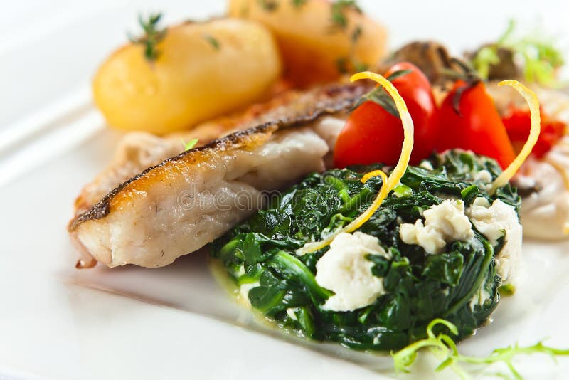 Baked fish with spinach stock photo. Image of spice, food - 50456882
