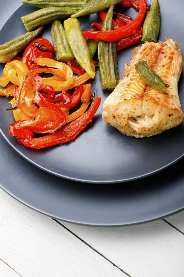Baked fish with vegetables stock photo. Image of portion - 195240346