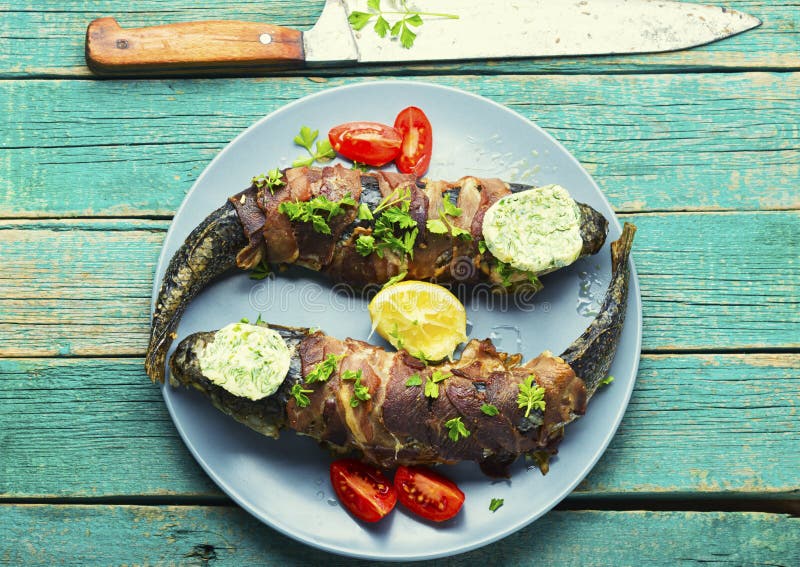 Baked Fish Wrapped in Bacon Stock Photo - Image of roasted, pelengas ...