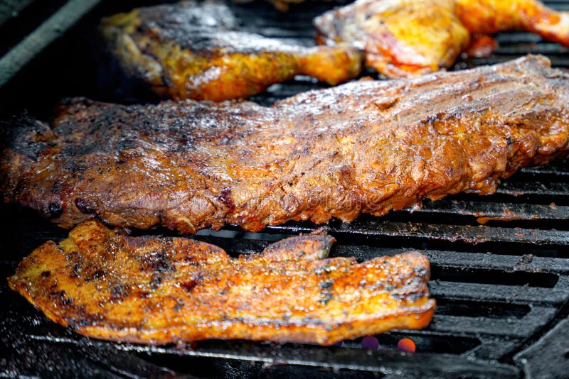 Baked and Fried Meat Cut into Pieces is Cooked Over a Fire on a Gas ...