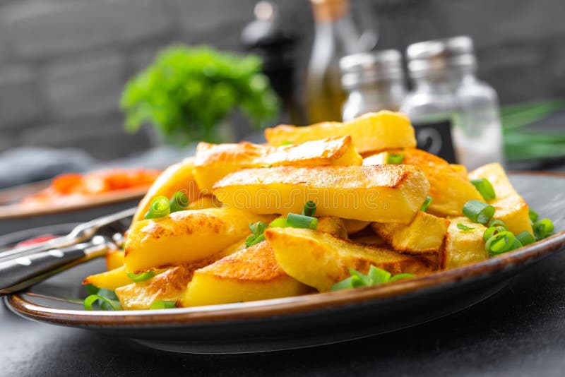 Baked, Fried Potato on Plate on Table Stock Photo - Image of baked ...