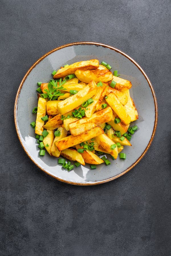 Baked, Fried Potato on Plate on Table Stock Image - Image of fried ...