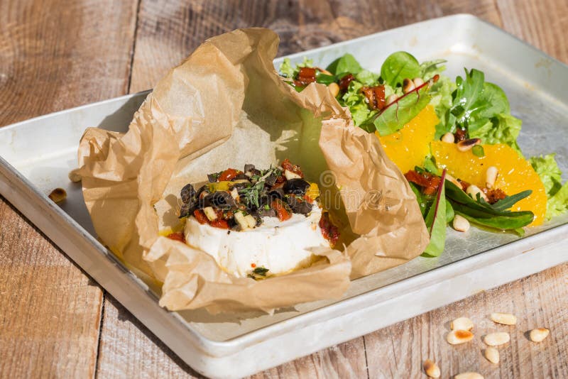 Baked Goat Cheese Mediterranean in Parchment Paper Stock Photo - Image ...