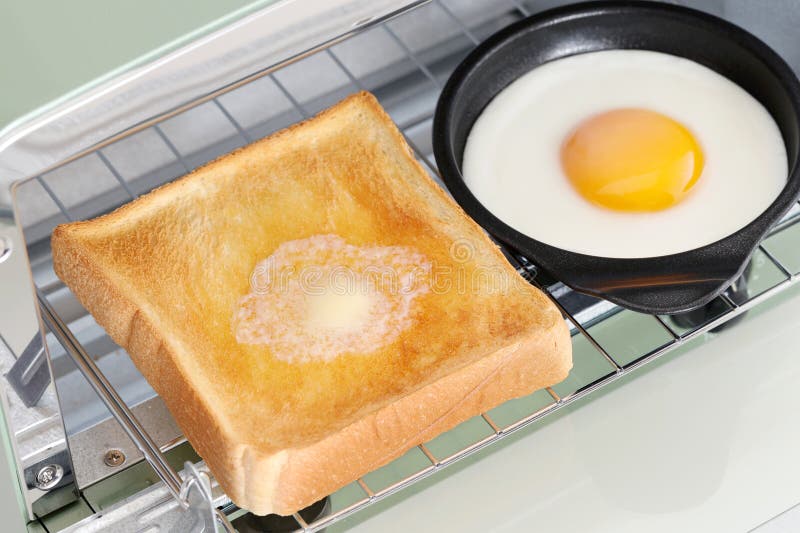 Baked Golden Toast and Fried Egg in Toaster Oven Stock Photo - Image of ...