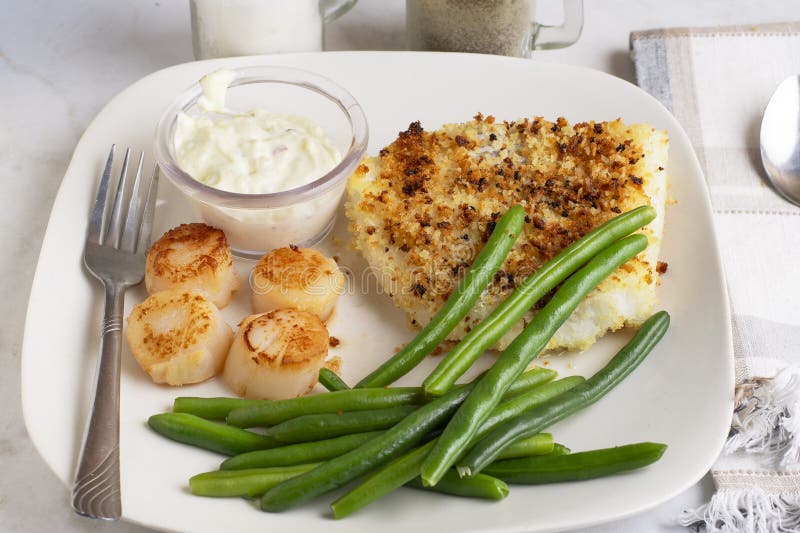 Baked Haddock Served with Scallops and Green Beans Stock Image - Image ...