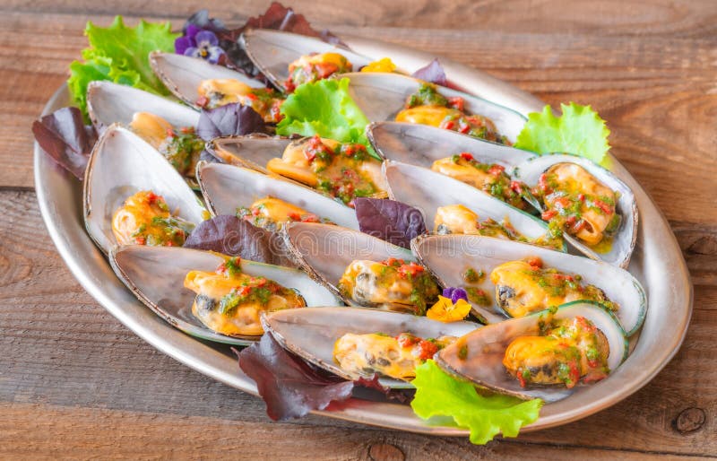 Baked half shell mussels stock image. Image of healthy - 276677499