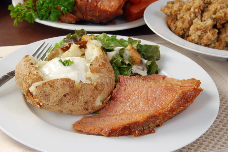 Baked ham dinner stock image. Image of stuffing, silverware - 17301141