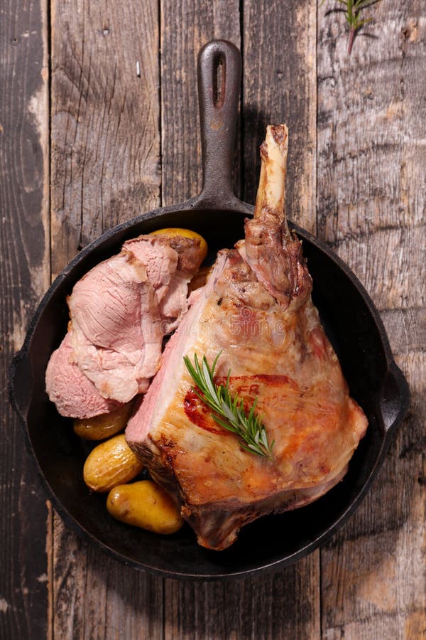 Baked lamb leg stock image. Image of dining, meat, gastronomy - 130782361