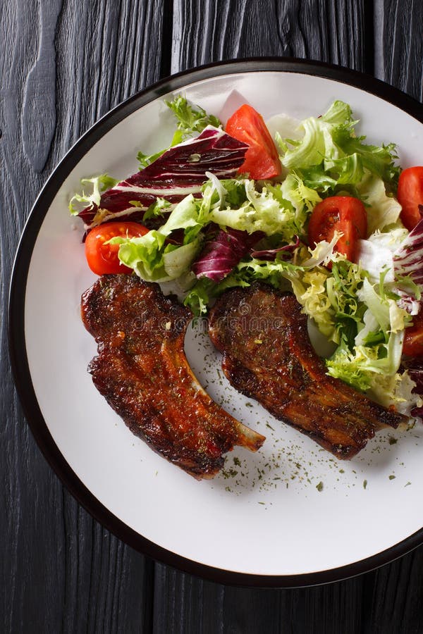 Baked Lamb Steak With Honey Served With Fresh Vegetable Salad Close Up On A Plate Vertical Top
