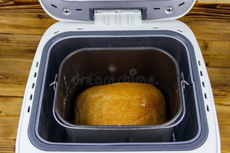 Baked Loaf of Bread in Electric Bread Maker Stock Image - Image of ...