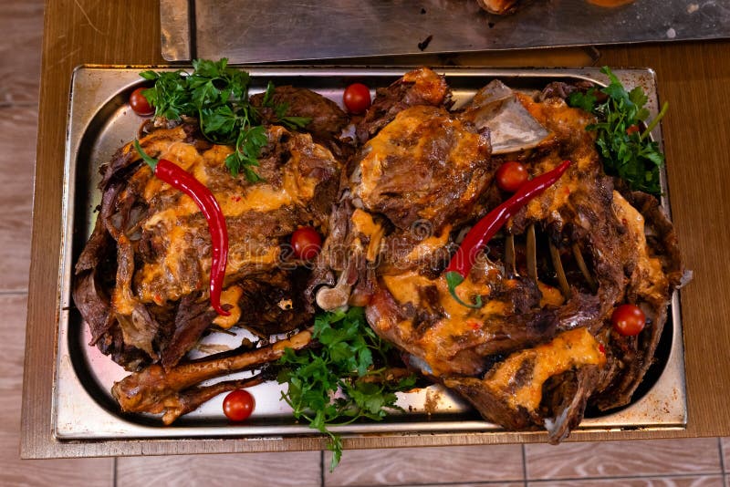 Baked meat on a metal tray stock photo. Image of cuisine - 150035220