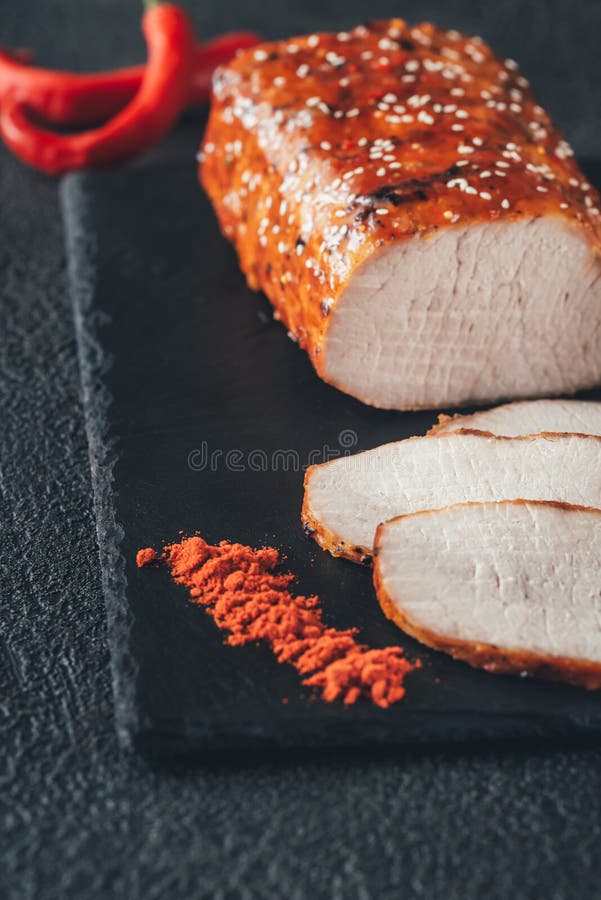 Baked Meat with Paprika on the Black Stone Board Stock Photo - Image of ...