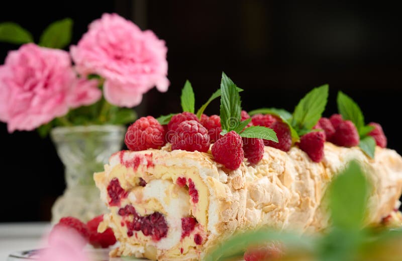 Baked Meringue Roll with Cream and Fresh Red Raspberry Stock Photo ...