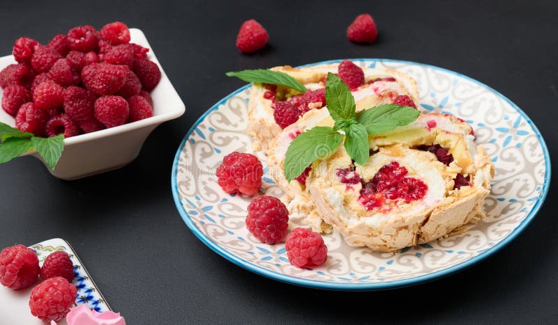 Baked Meringue Roll with Cream and Fresh Red Raspberry Stock Photo ...