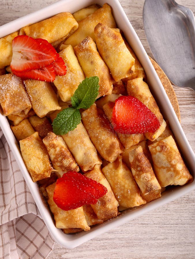 Baked Mini Crepes Rolls Filled with Cheese Stock Image - Image of rolls ...