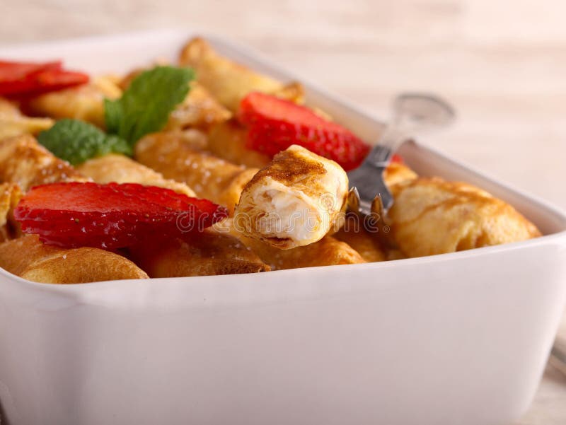 Baked Mini Crepes Rolls Filled with Cheese Stock Image - Image of ...