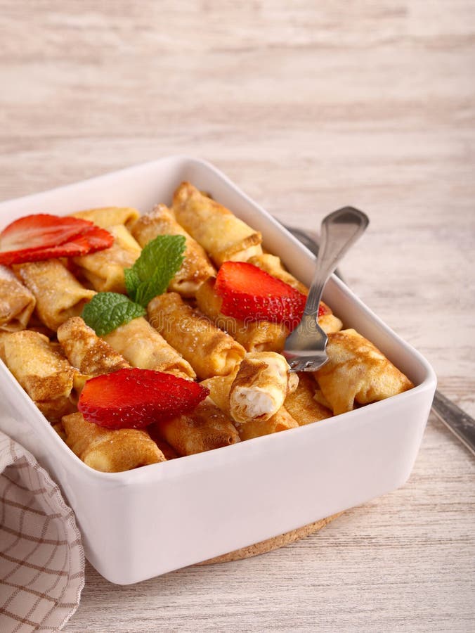 Baked Mini Crepes Rolls Filled with Cheese Stock Image - Image of ...