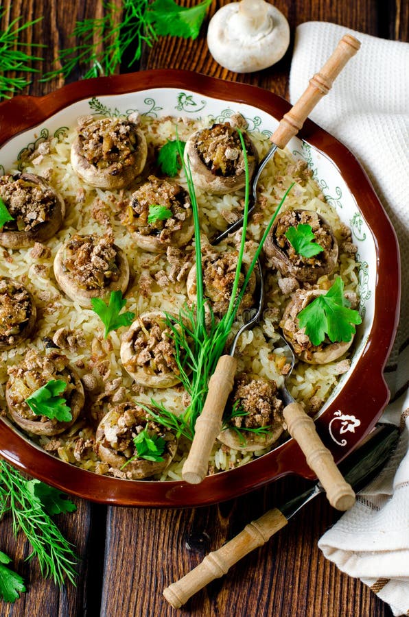 Baked mushrooms on rice stock image. Image of meal, filled - 76933103