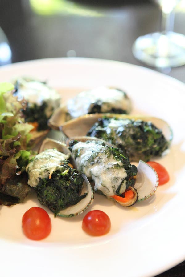 Baked mussels with cheese stock photo. Image of mussel - 141569300