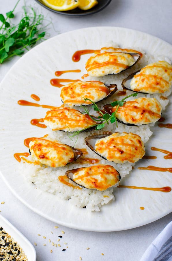 Baked Mussels with Cheese in Shells on Rice in a Plate Stock Image ...