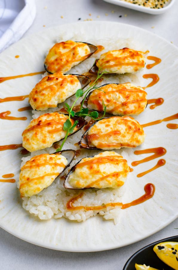 Baked Mussels with Cheese in Shells on Rice in a Plate Stock Image ...