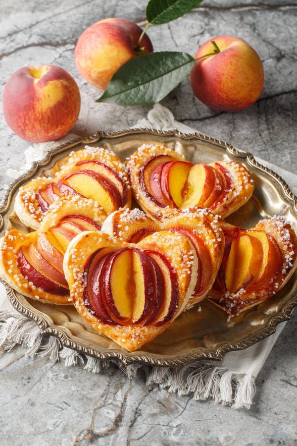 Baked Peach Puff Pastry Cakes with Fresh Fruit and Jam Close-up in a ...