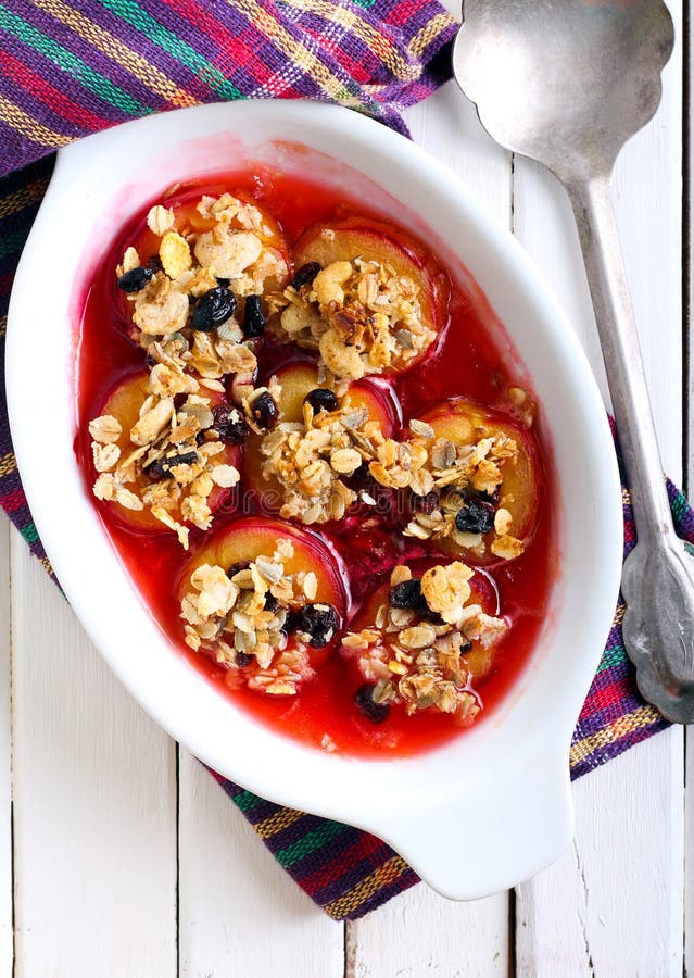 Baked Plums with Muesli Crumble Topping Stock Photo - Image of raisin ...