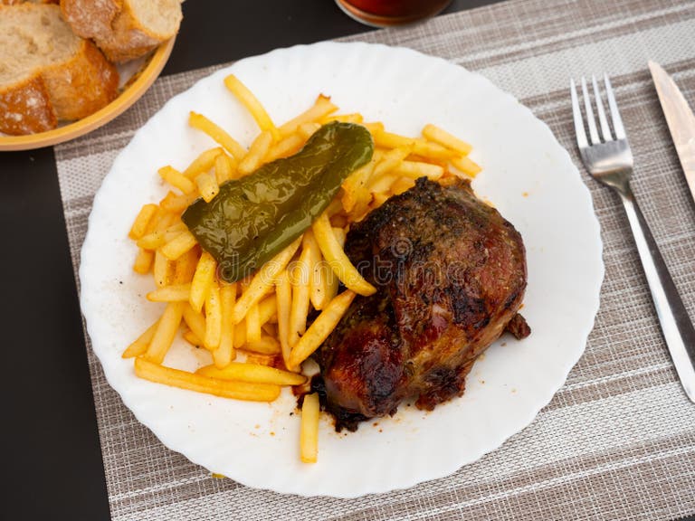 Baked Pork Cheeks Served with Potatoes Stock Photo - Image of european ...