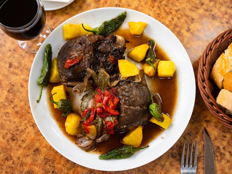 Baked Pork Cheeks Served with Potatoes Stock Photo - Image of dish ...